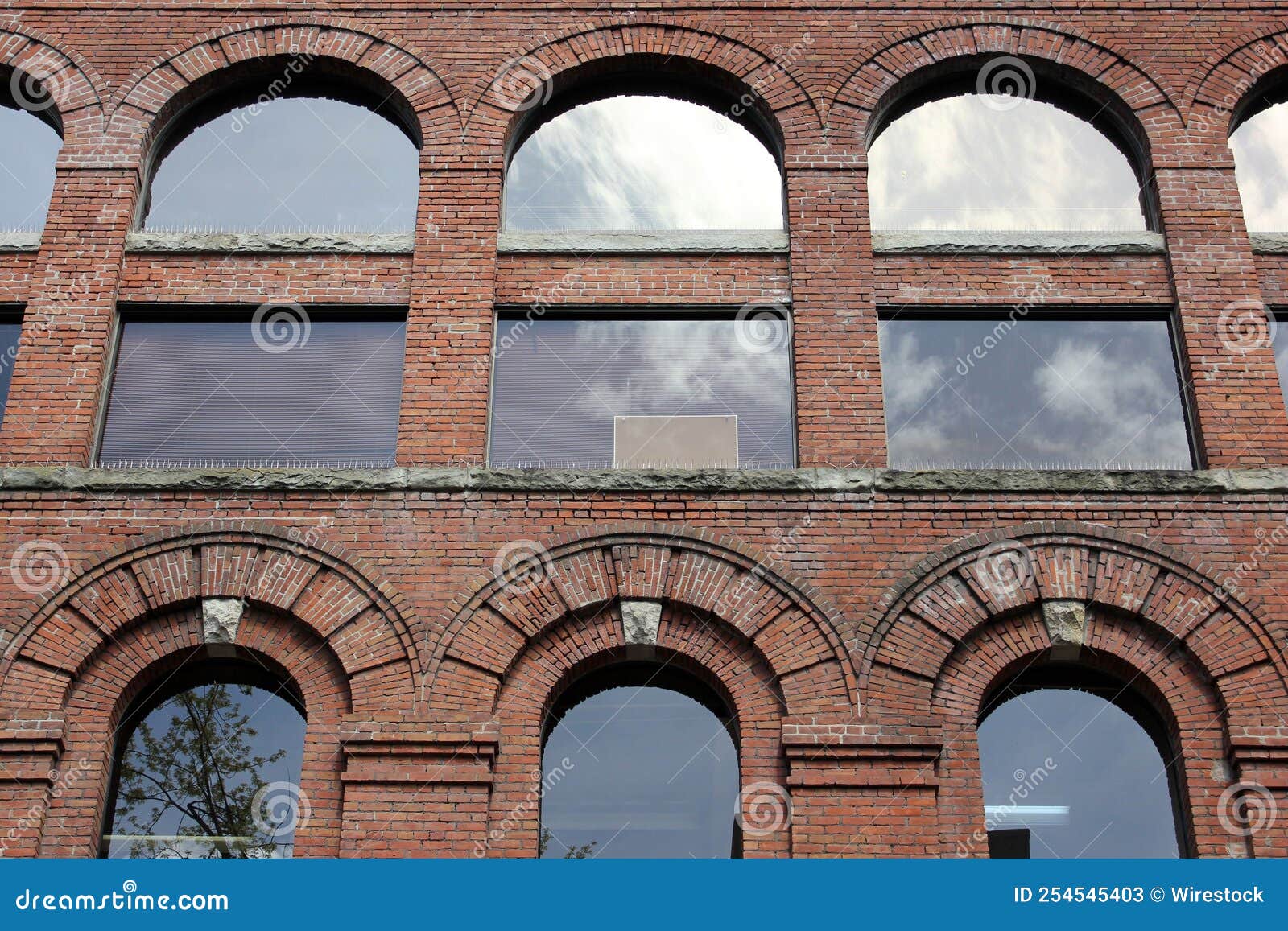 Brick Facade with Arch Windows of an Old Historical Building Stock ...
