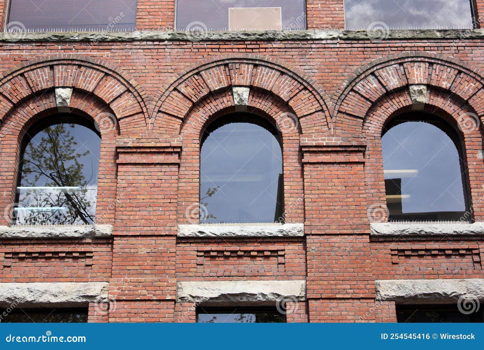 Brick Facade with Arch Windows of an Old Historical Building Stock ...