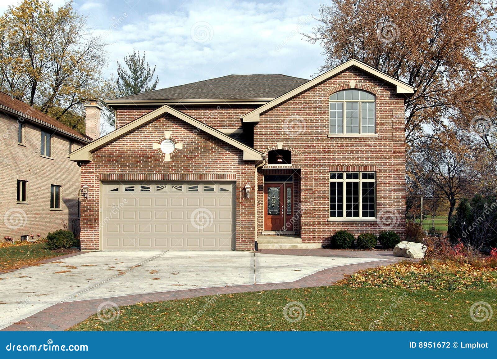 Brick home in fall stock photo. Image of yard, driveway - 8951672