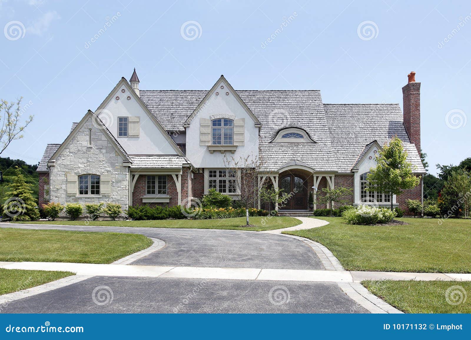 Brick home in suburbs stock photo. Image of landscaping - 10171132