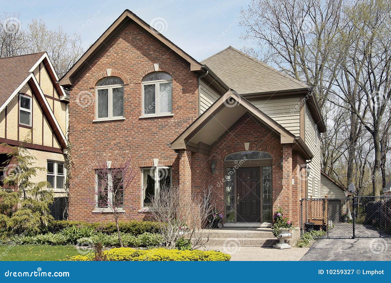 Brick home in suburbs stock image. Image of expensive - 10259327