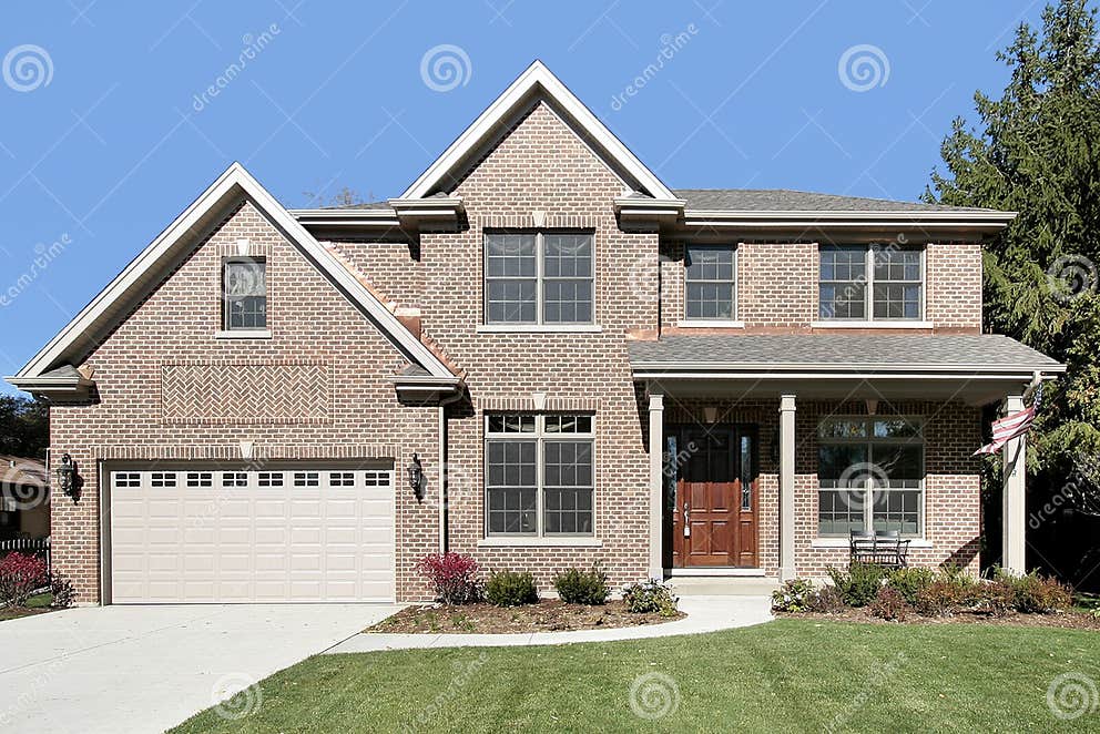 Brick home in suburbs stock photo. Image of driveway - 10416578