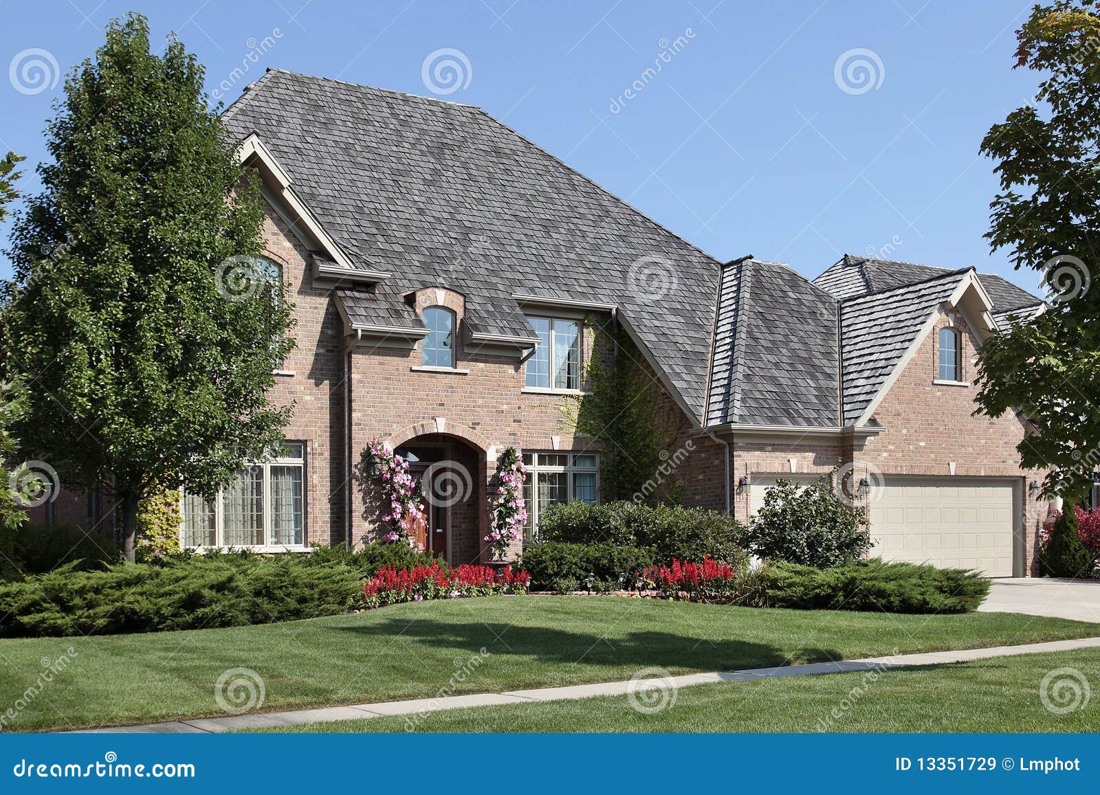 Brick home in suburbs stock image. Image of expensive - 13351729
