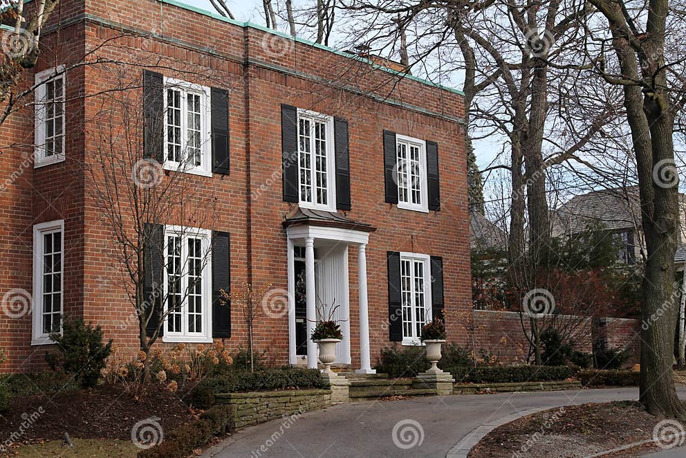Brick House with Black Shutters Stock Photo - Image of driveway ...