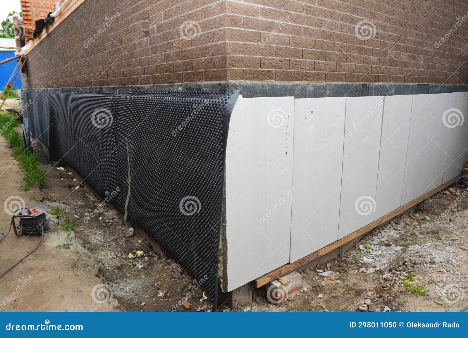 Waterproofing A New Brick House Foundation With Spray On Tar ...