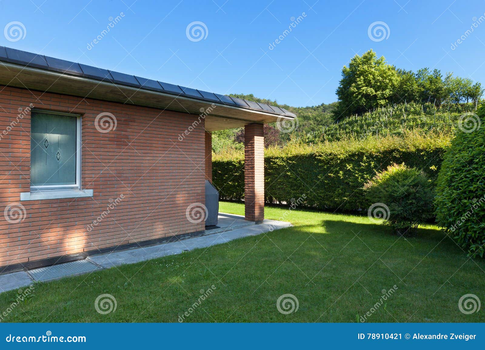 Brick house with garden stock image. Image of garden - 78910421