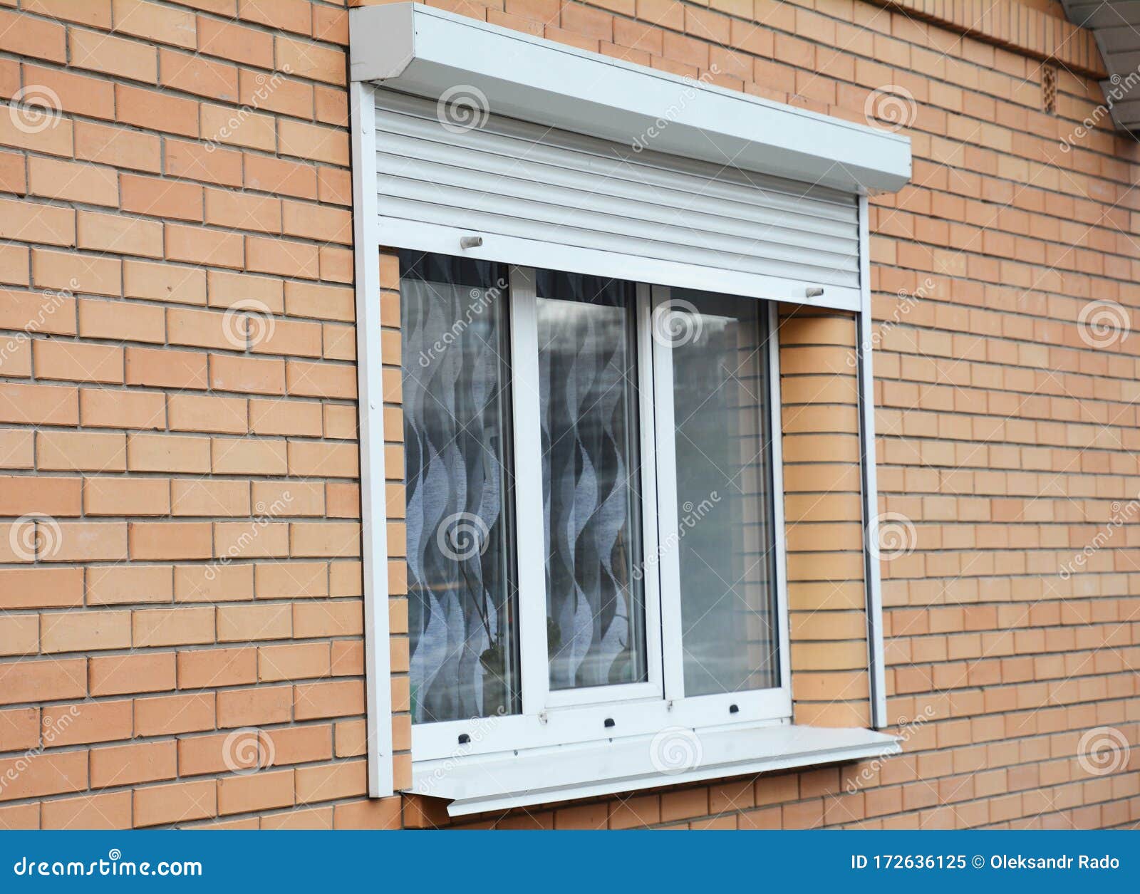 Brick House Window with Rolling Shutter for Home Protection Stock Image ...