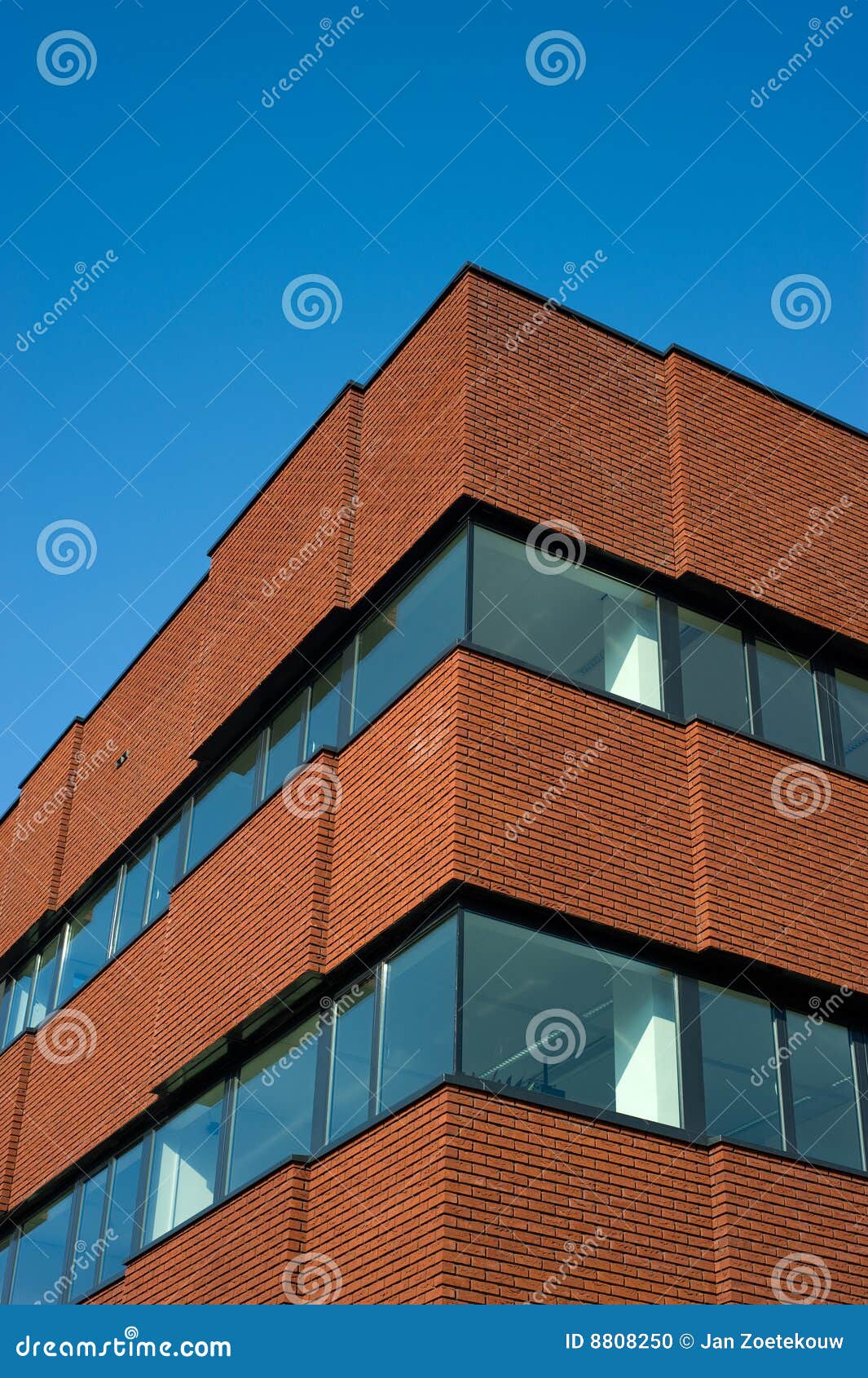 Brick Office Building With Prominent Stone Quoin Blocks And Carved ...