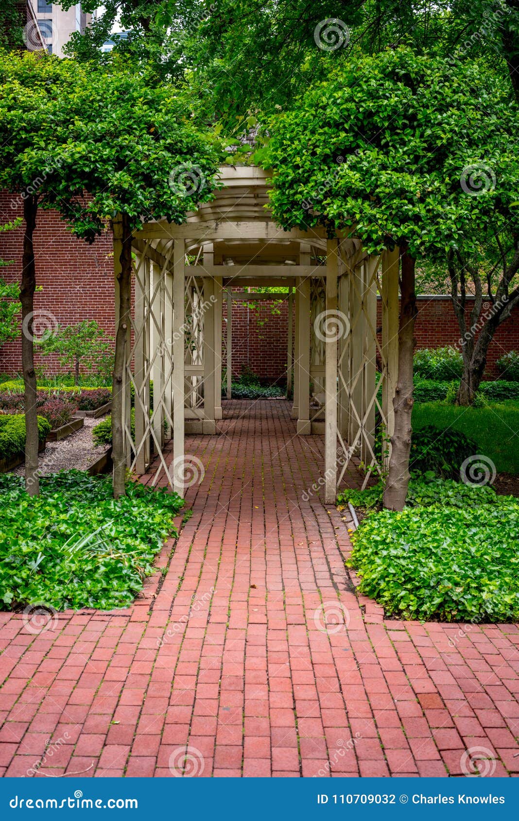 Atrium with Brick Path Leads through a Garden Stock Photo - Image of ...