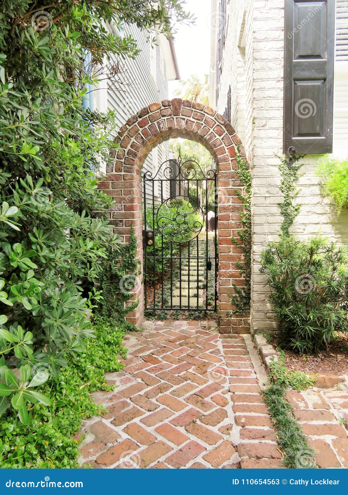 Brick Archway and Wrought Iron Gate Stock Image - Image of entrance ...