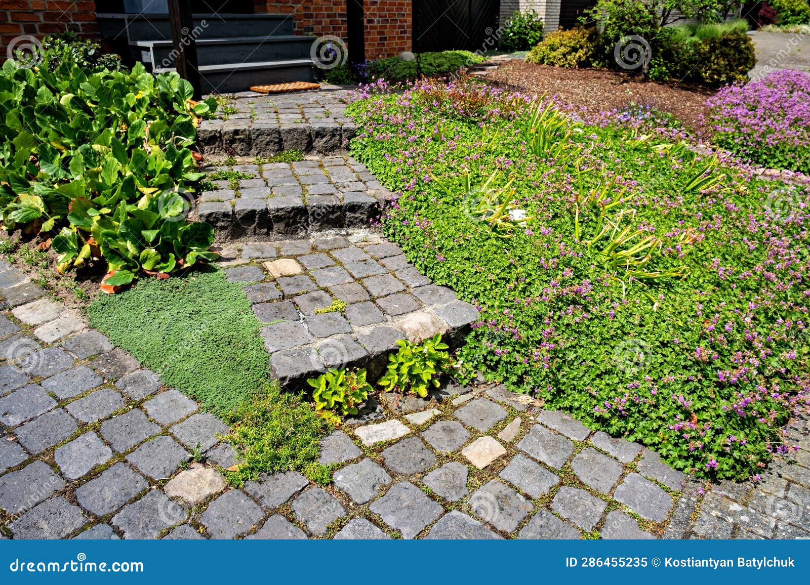 Brick Pathway Leads Up To Brick Building with Steps Leading Up To it in ...