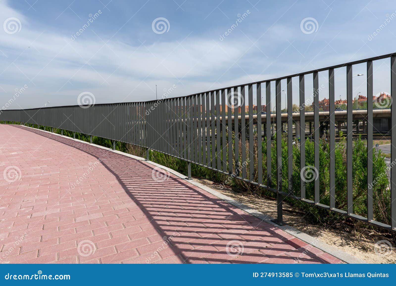Brick Pathway with Metal Railing Casting Shadow Stock Image - Image of ...