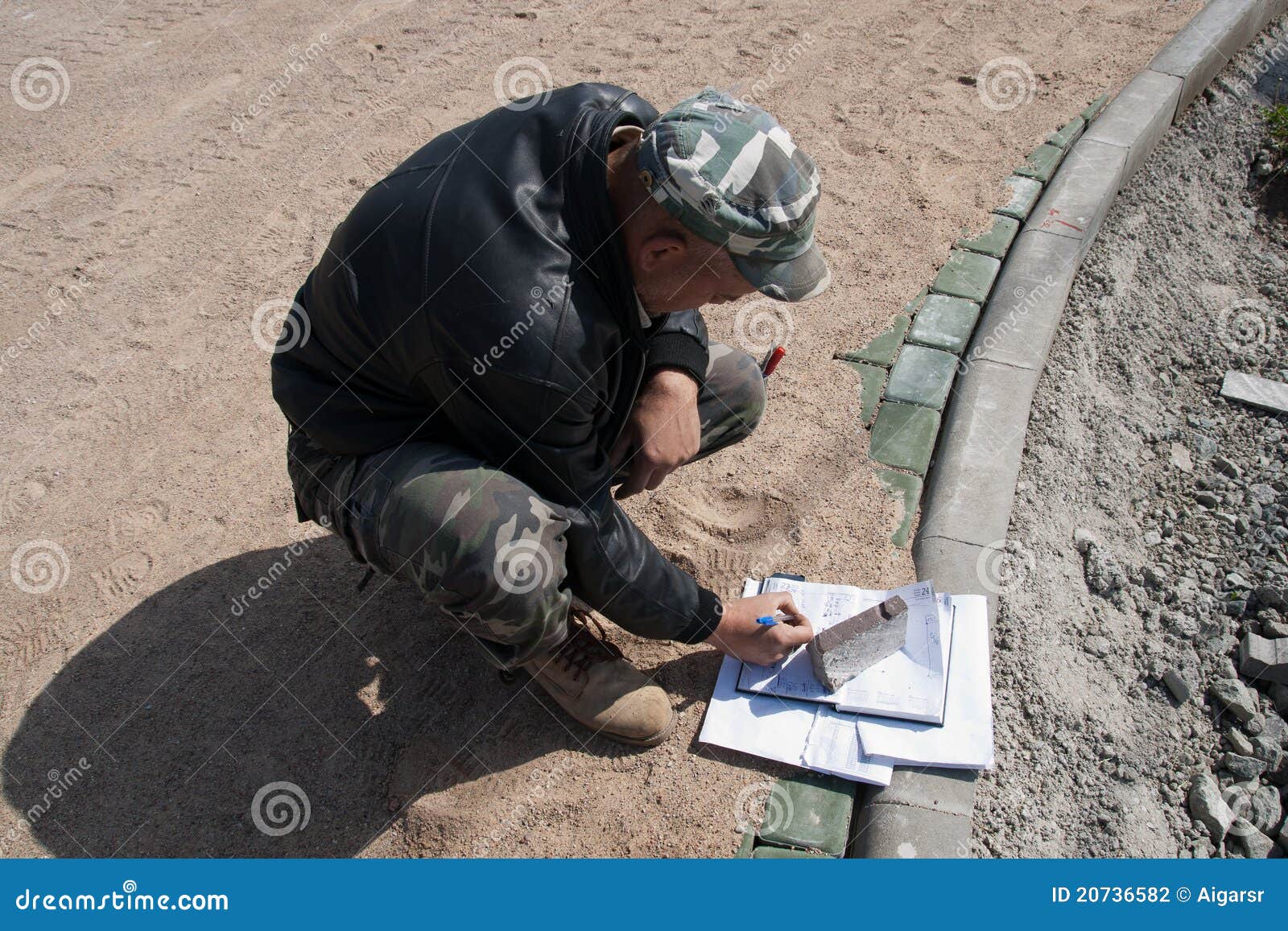 Brick Paver Working. Worker Lay Paving Tiles, Construction Of Brick ...