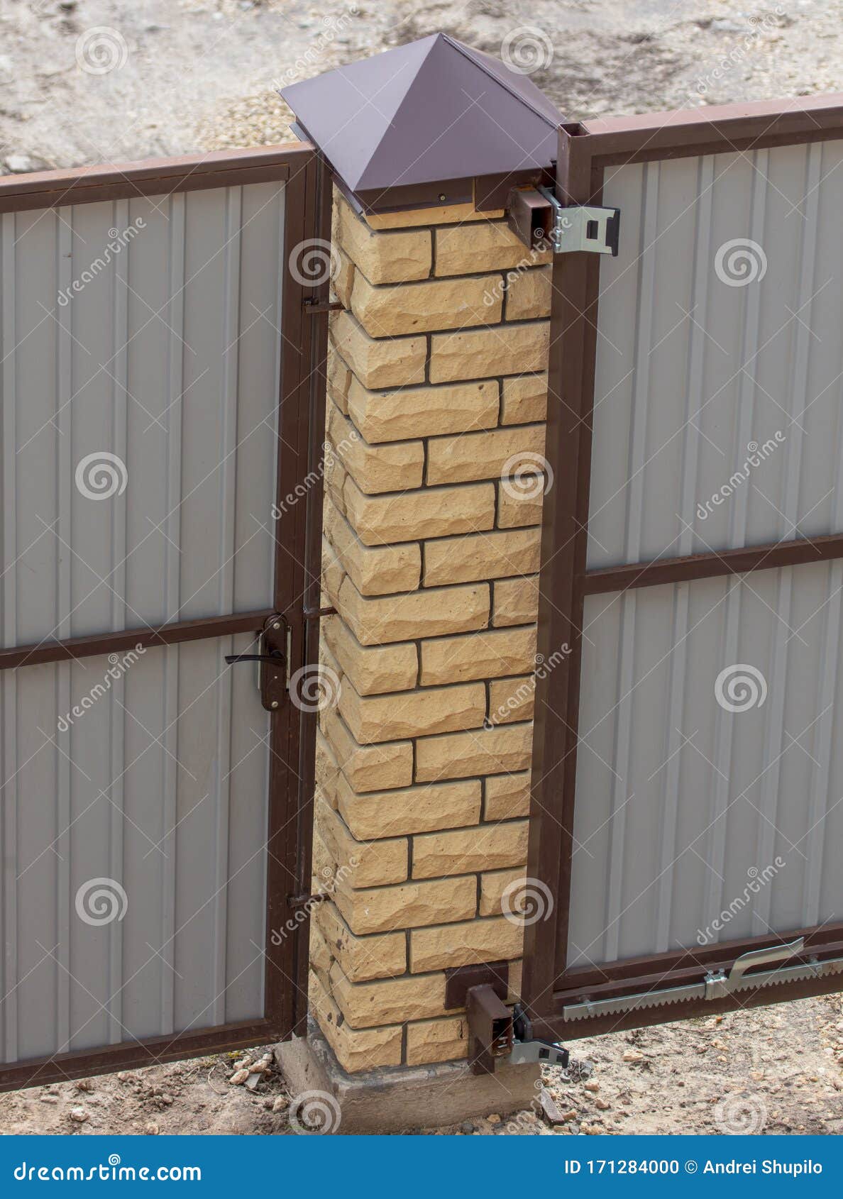 Brick pillar in the fence stock photo. Image of metal - 171284000