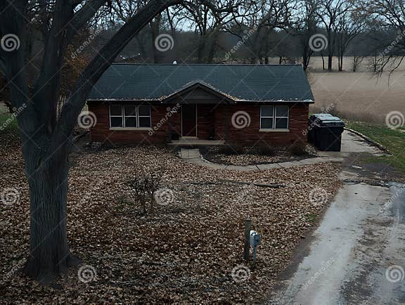 Brick Ranch House on a Leaf-Covered Lawn Stock Photo - Image of brown ...