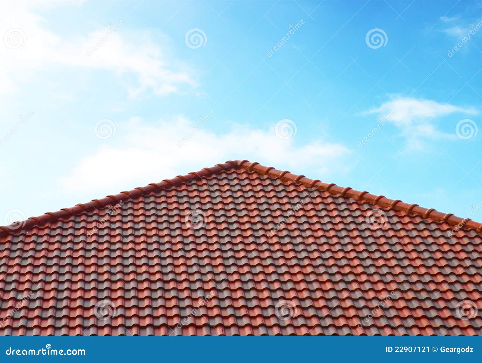 Red Brick Roof With Chimneys And Tv Antennas On A Clear Blue Sky ...