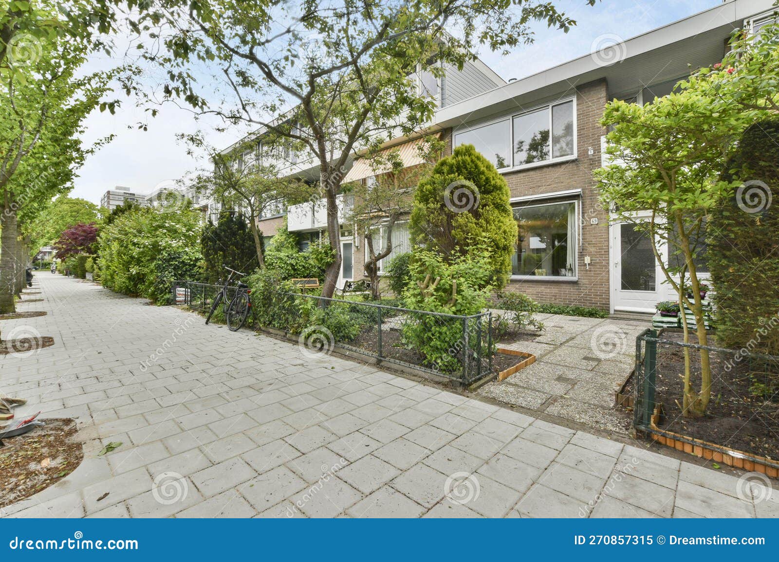 A Brick Sidewalk in Front of a House with Trees Editorial Image - Image ...
