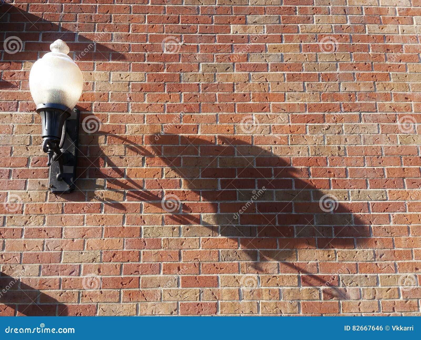 Red Brick Wall with Light Fixture Stock Photo - Image of mason, tone ...