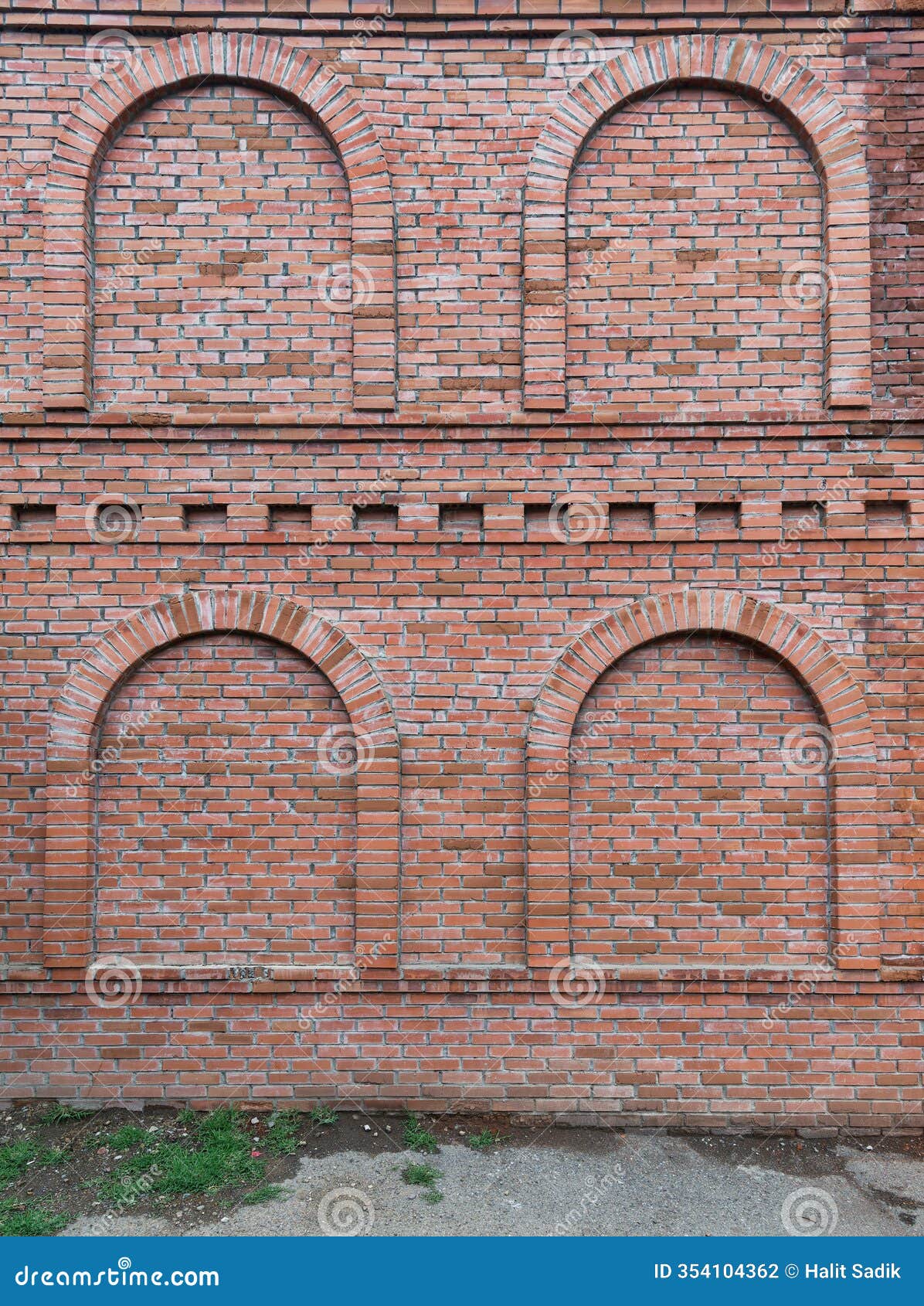 Brick Wall with Arched Openings in a Residential Area during the Day ...