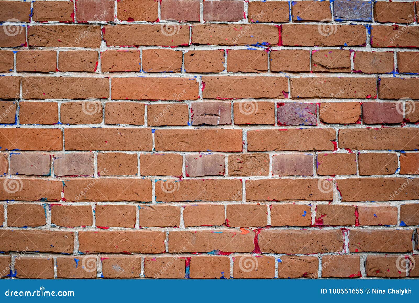 The Texture of Red Brick with Bright Splashes of Colored Paint. Stock ...