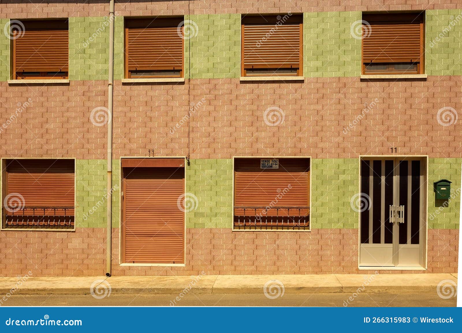 Brick Wall of a Building with Blinds on the Windows Stock Image - Image ...