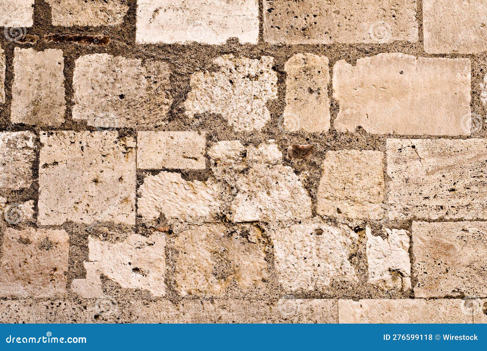 Brick Wall with a Cement Overlay, Featuring a Textured Pattern of Small ...