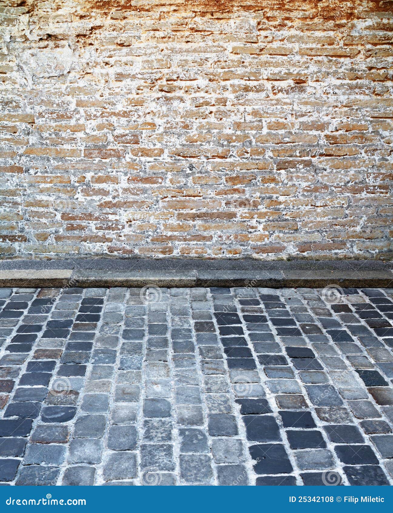 Brick Wall and Cobblestone Street Stock Photo - Image of brick, stone ...