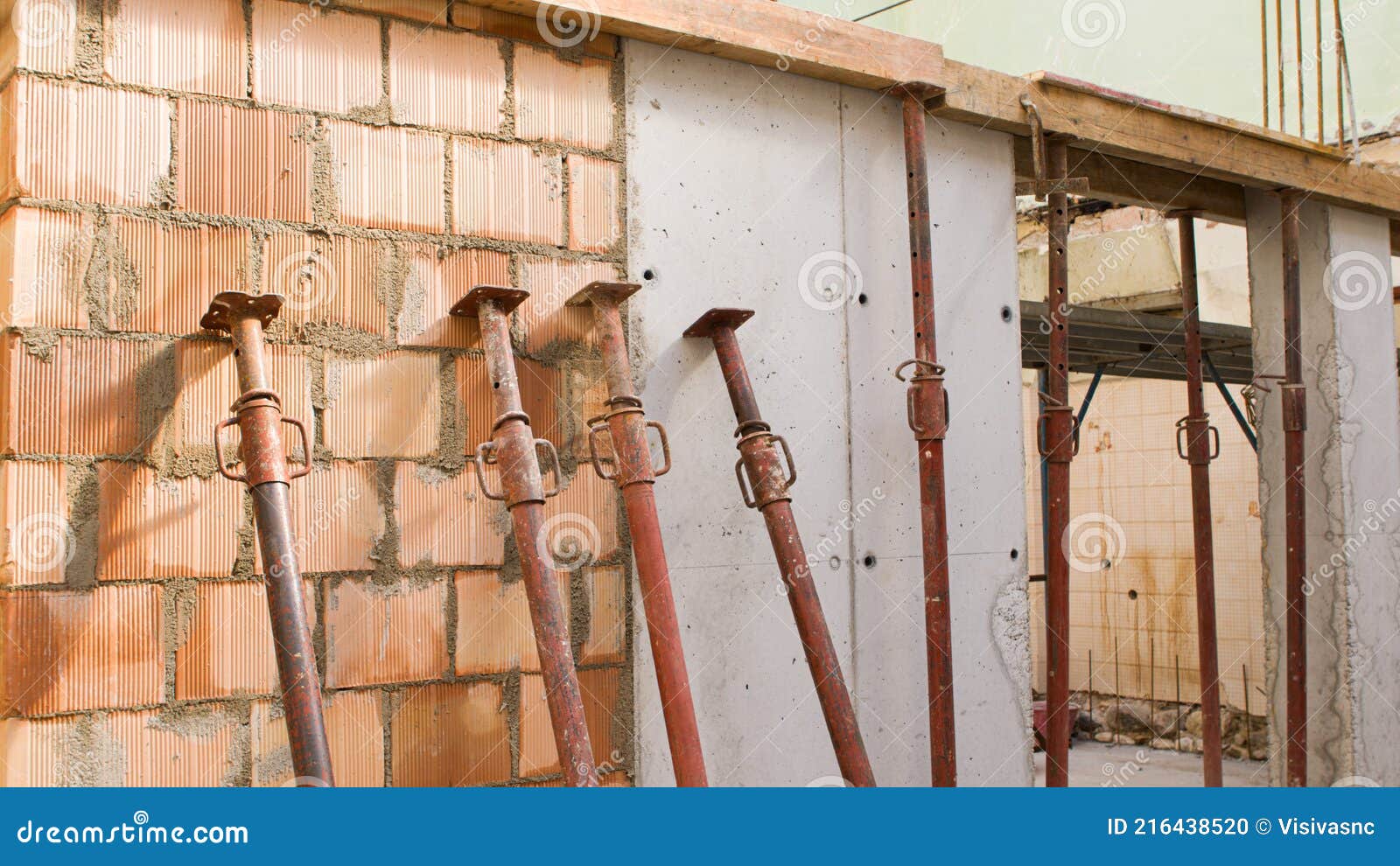 Brick Wall of a Construction Site with Iron Props and Reinforced ...