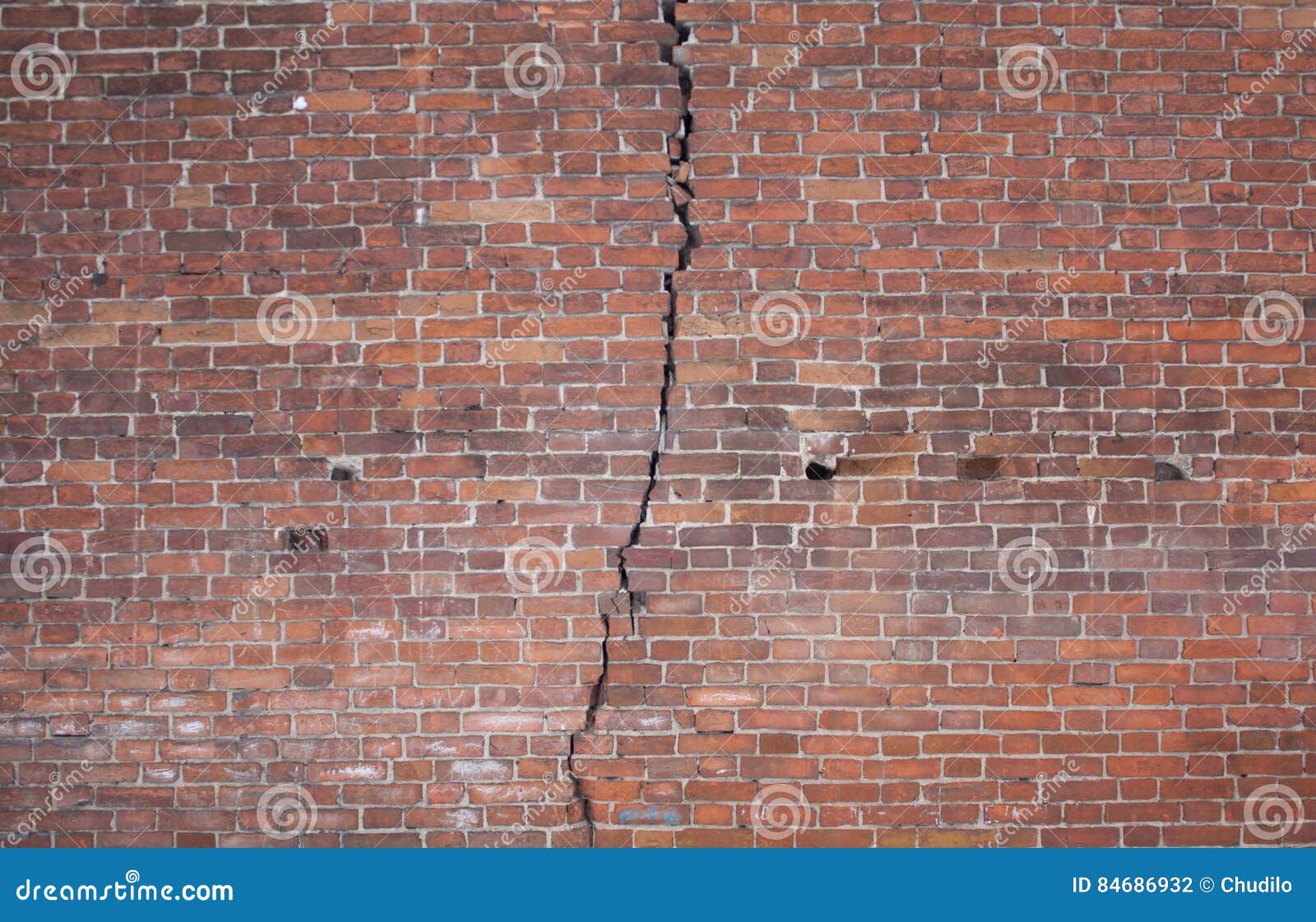 Brick wall with a crack stock photo. Image of exterior - 84686932