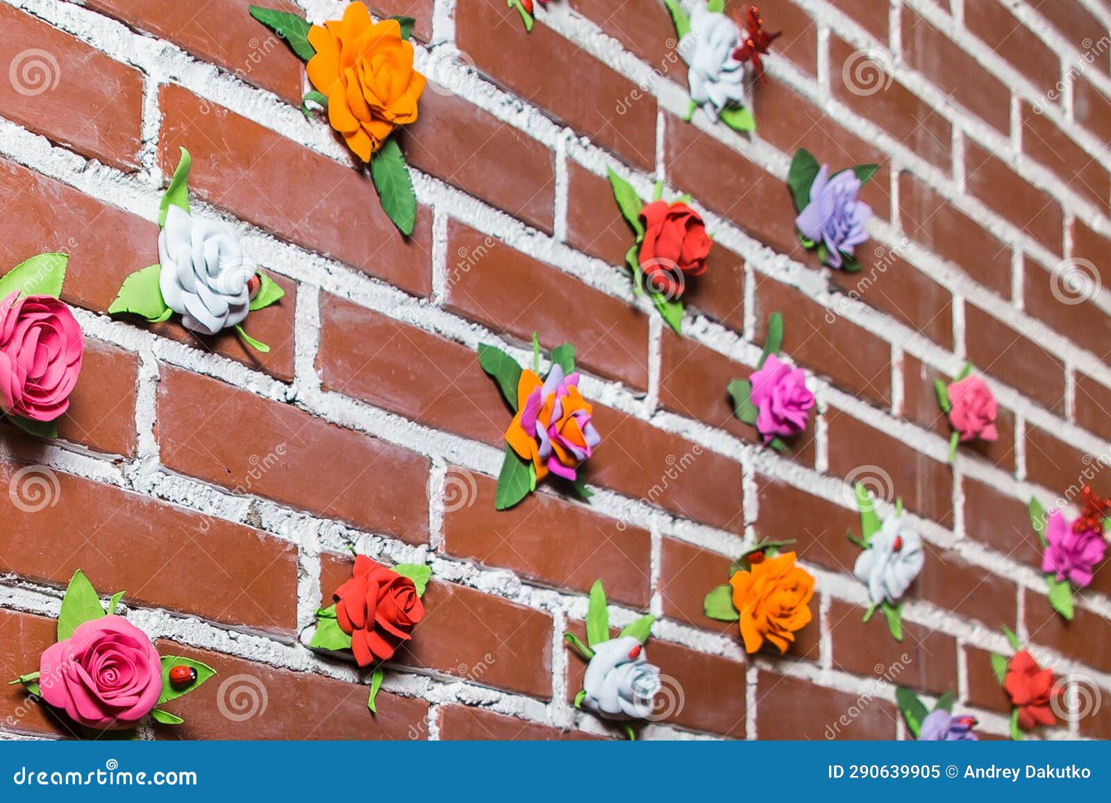 The Brick Wall is Decorated with Artificial Objects, Flowers, Multi ...