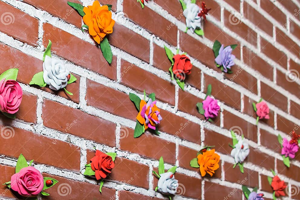 The Brick Wall is Decorated with Artificial Objects, Flowers, Multi ...