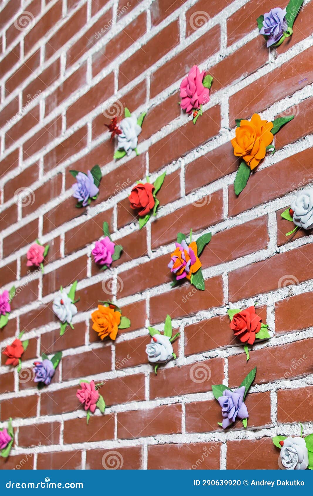The Brick Wall is Decorated with Artificial Objects, Flowers, Multi ...