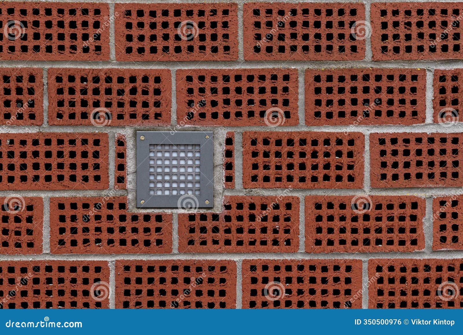 Brick Wall with Decorative Ventilation Blocks and a Light Fixture Stock Photo - Image of empty ...