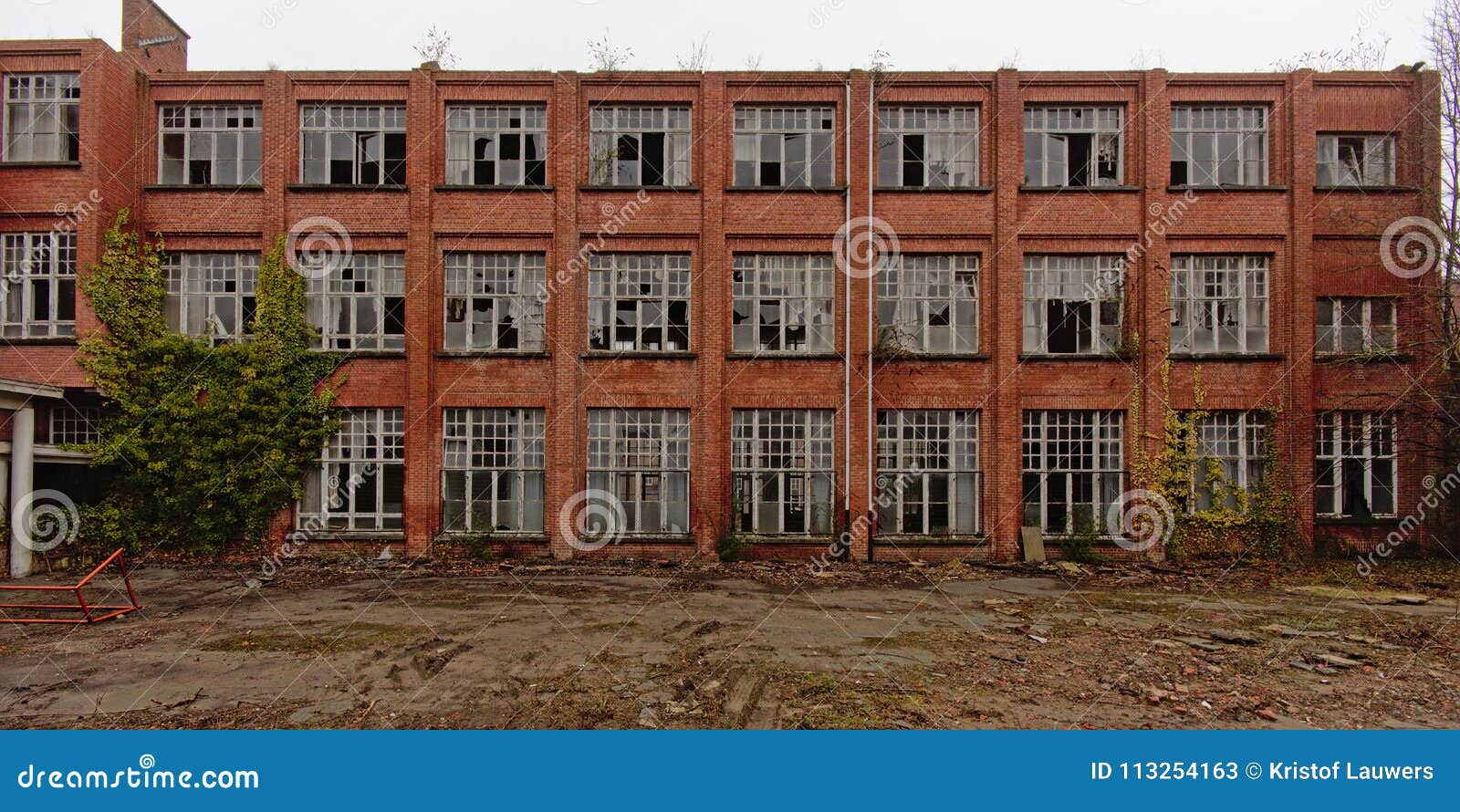Brick Wall Facade with Broken Windows of an Abandoned School Stock ...