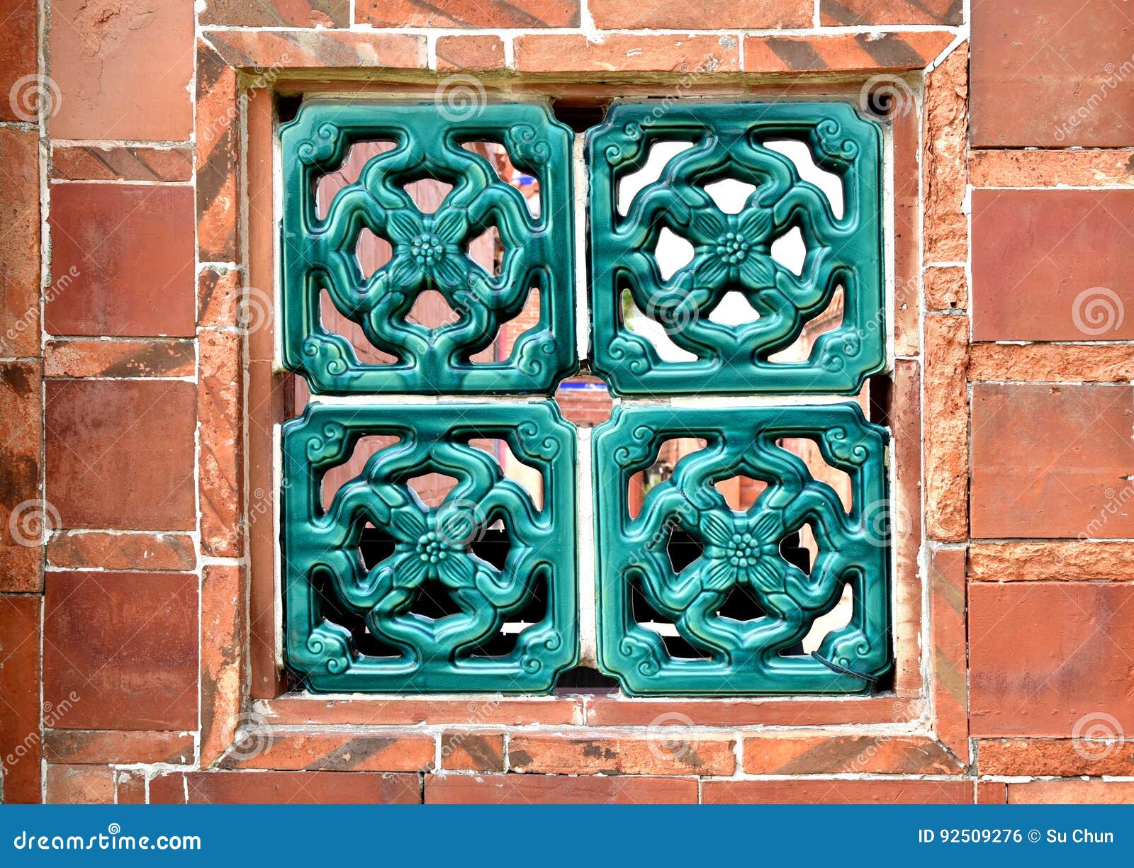 Brick Wall and Latticework Window Stock Photo - Image of floral ...