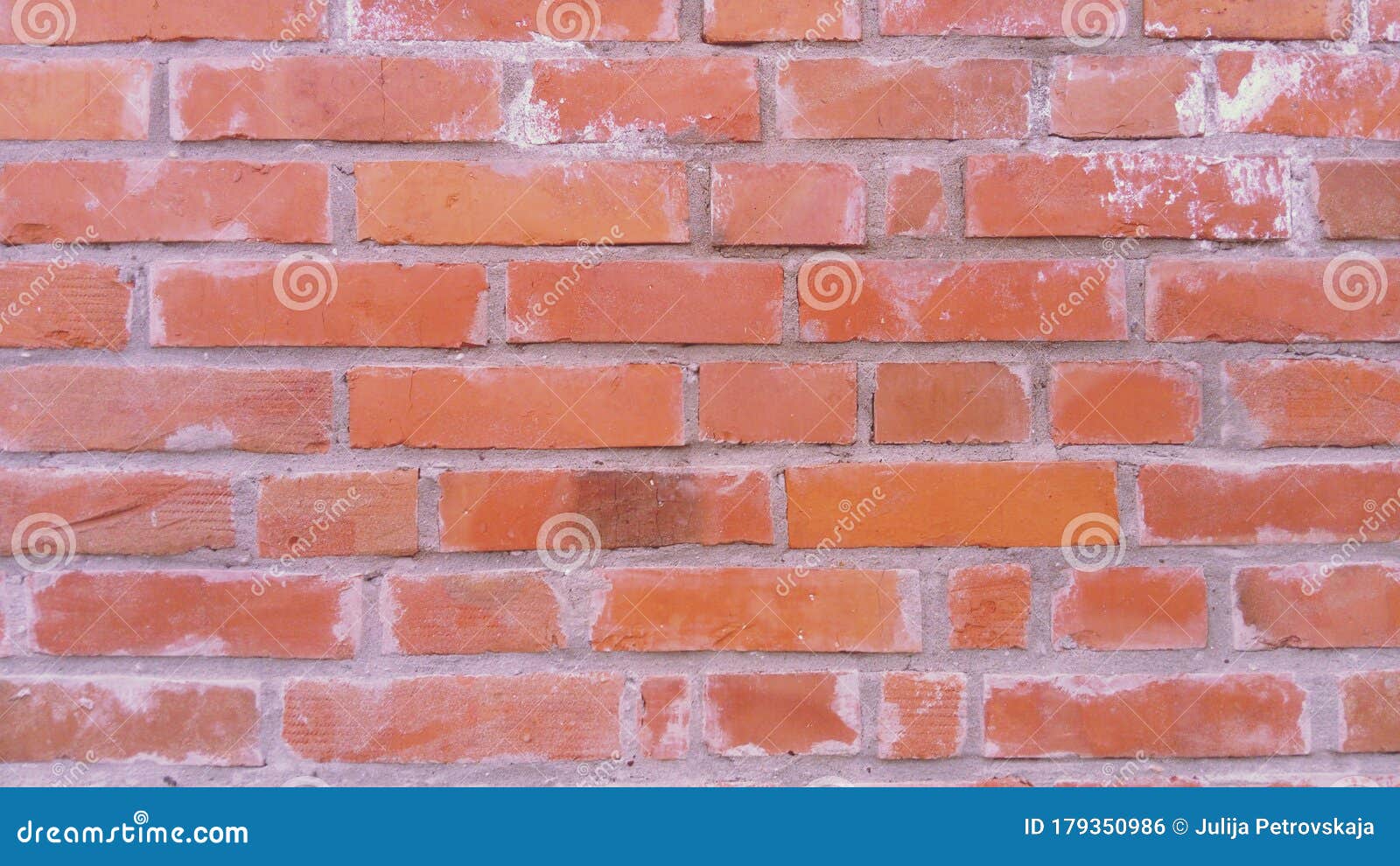 Brick Wall Made of Bright Red Bricks. Lightly Worn Surface. Neat ...