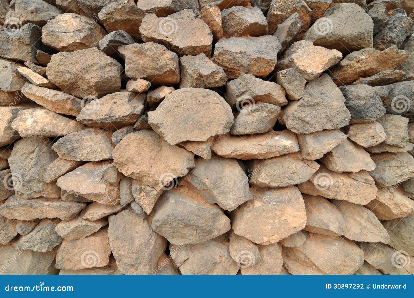 Brick wall made of rocks stock photo. Image of architect - 30897292