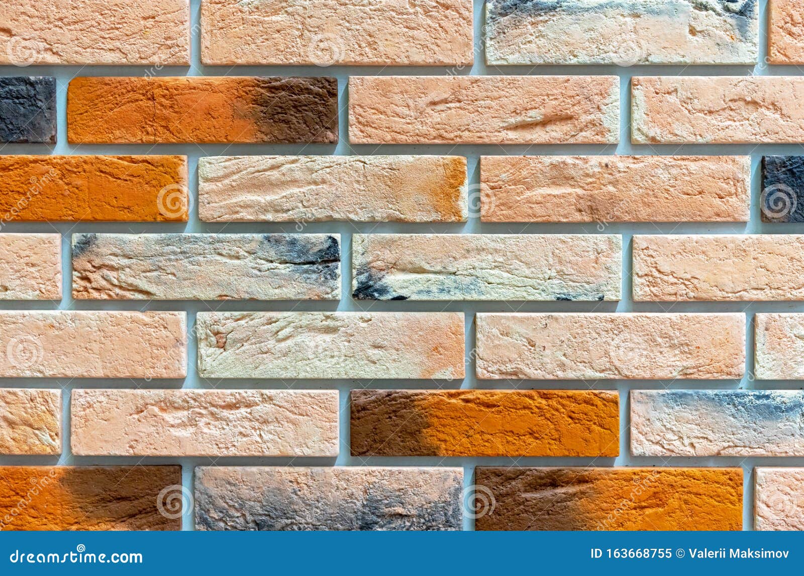 Brick Wall of Multicolored Bricks. Background and Texture of Brickwork ...