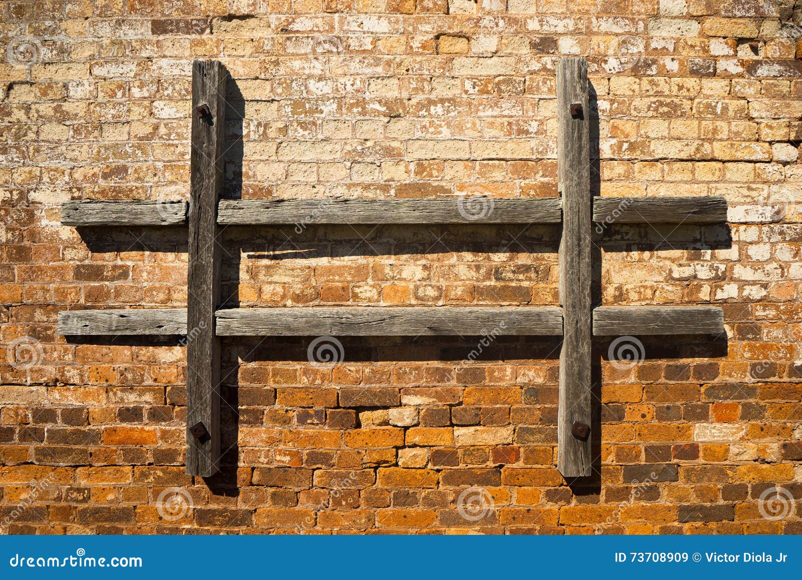 Brick wall with old timber stock image. Image of outside - 73708909