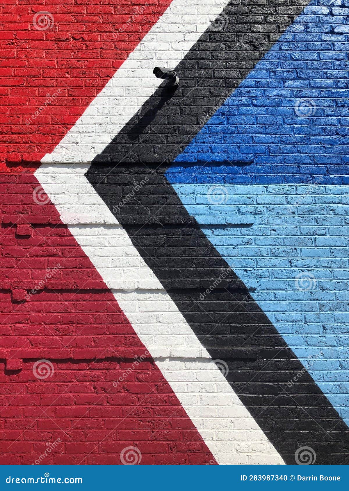 Brick Wall Painted with Different Colors and Geometric Designs. Stock ...