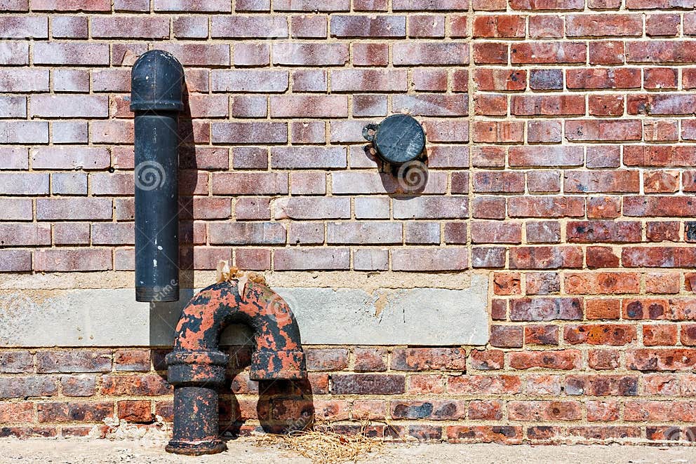 Brick Wall and Pipes stock image. Image of textures, brickwall - 6541259