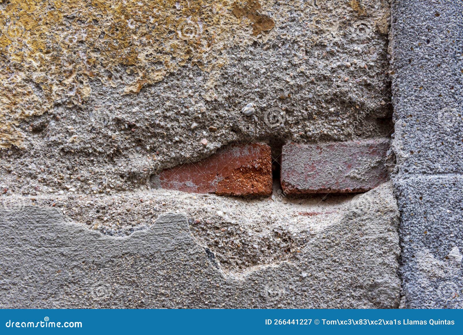 A Brick Wall Plastered with Sand and Cement that is Falling Apart Stock ...