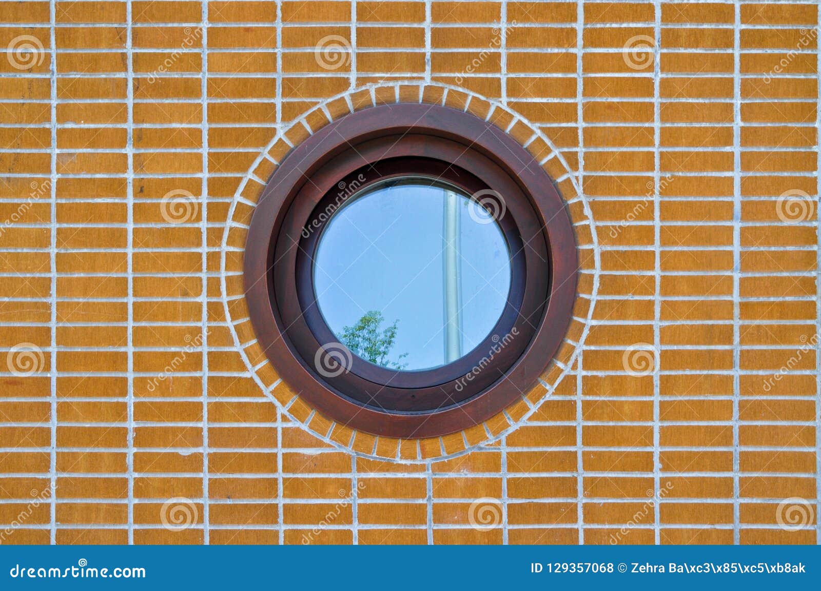 Brick Wall and Round Window Stock Photo - Image of horizontal, exterior ...