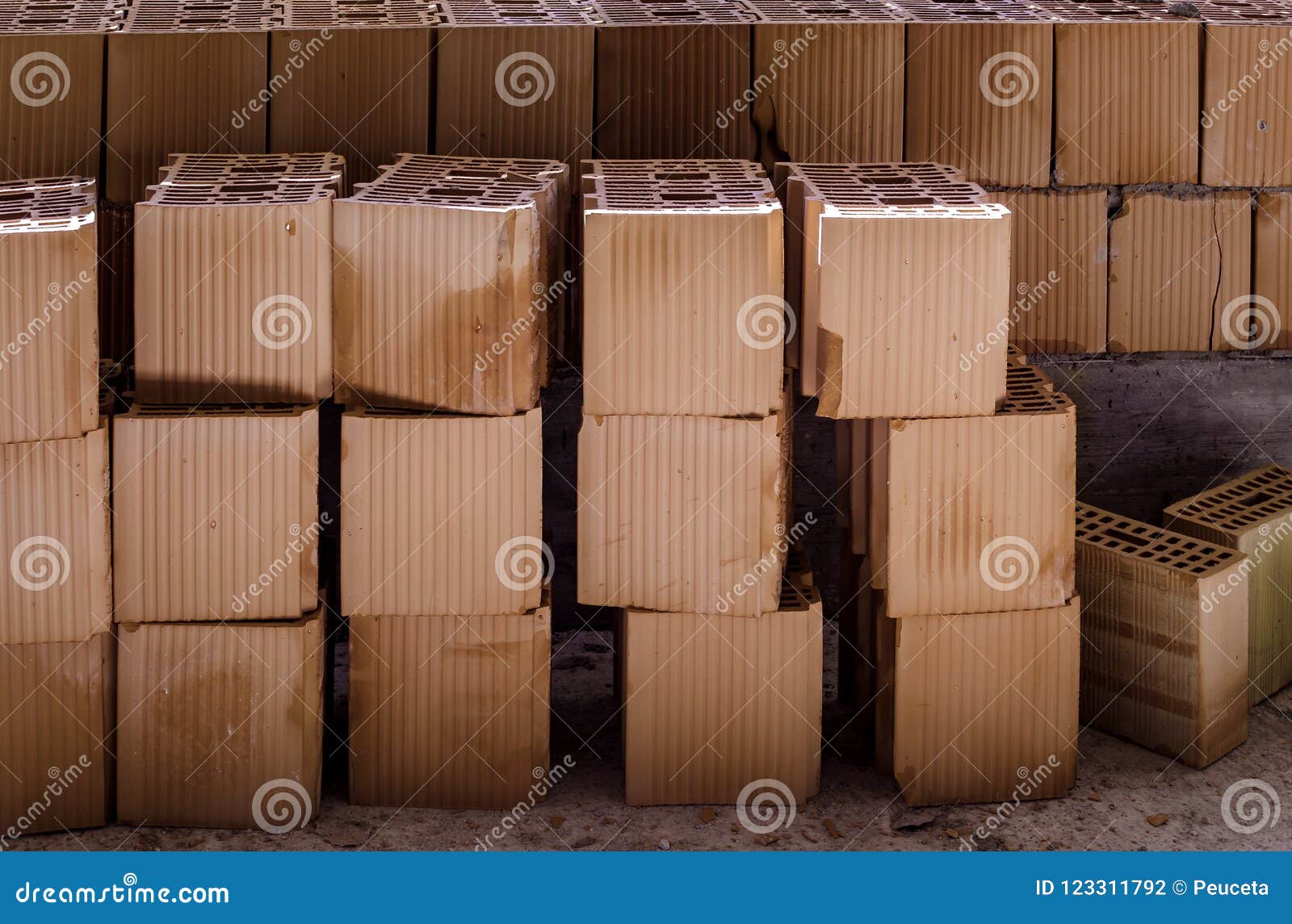 Brick Wall with a Stack of New Bricks Stock Photo - Image of stack ...