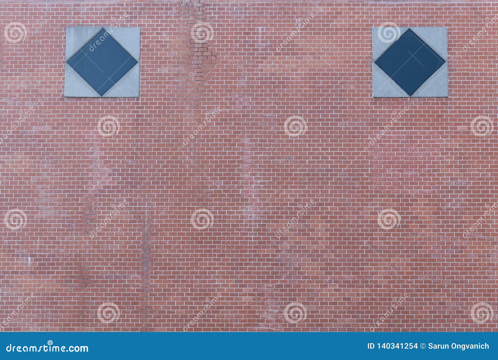 Old Brick Wall with Two Black Window Diamonds Shape Stock Photo - Image ...
