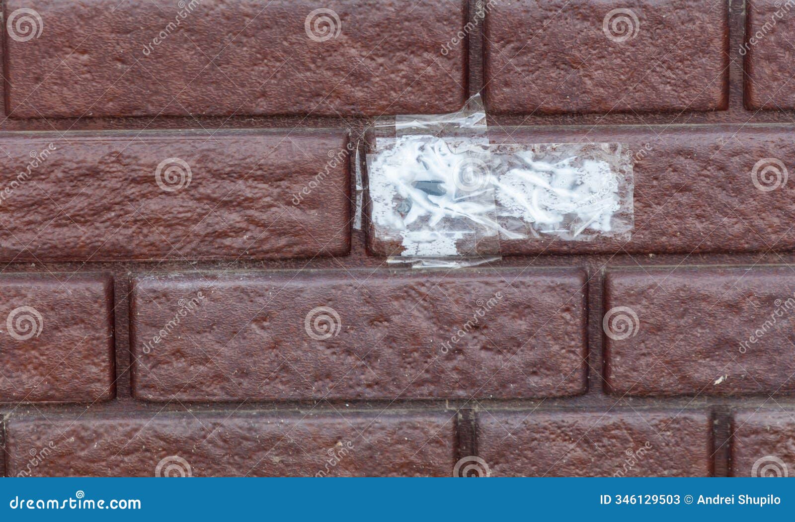 A Brick Wall with a White Sticker on it Stock Image - Image of ...