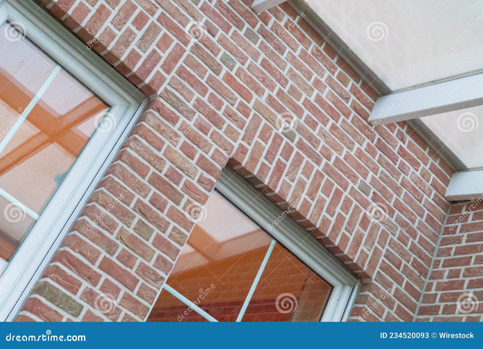 Brick wall with windows stock image. Image of construction - 234520093