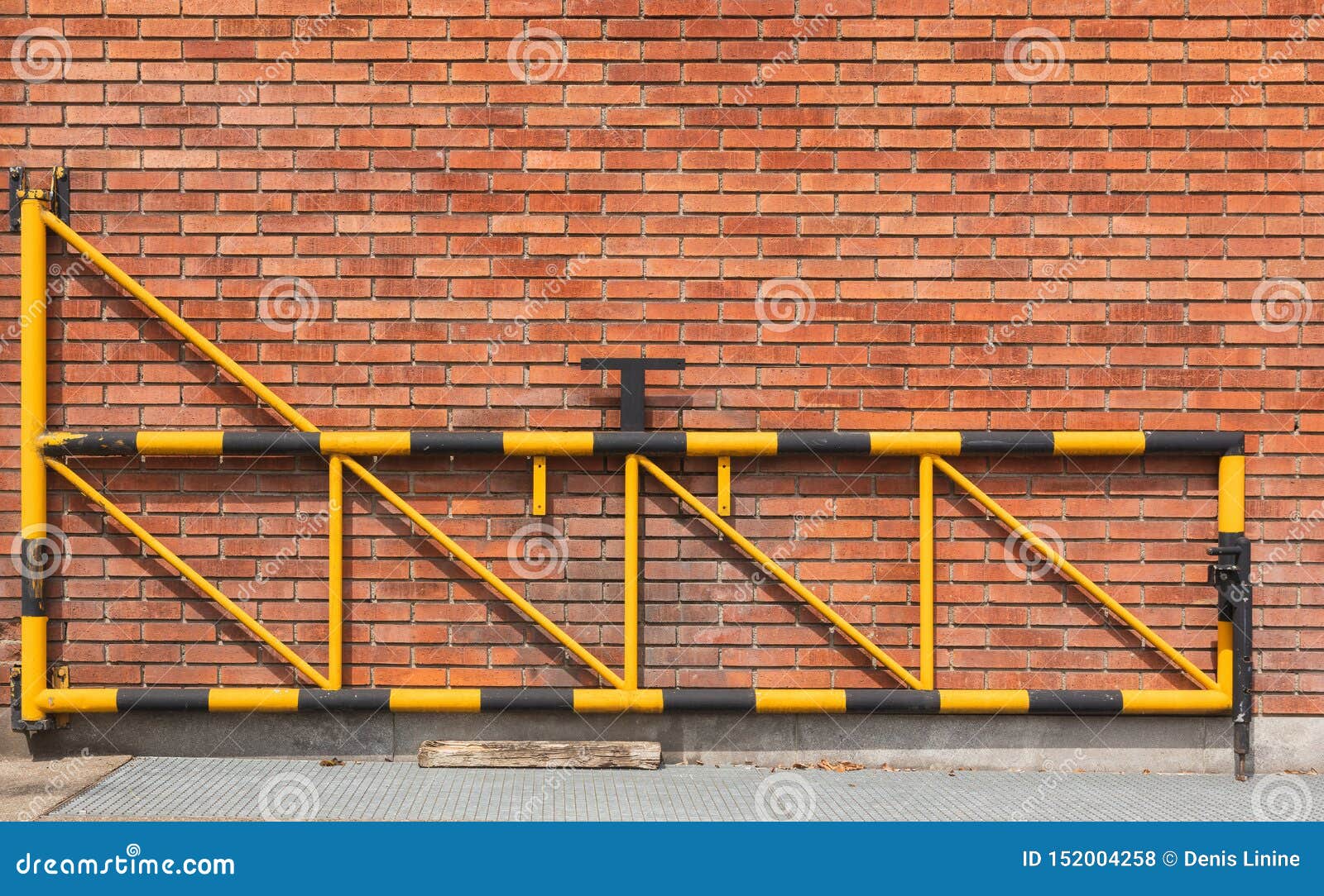 A Brick Wall and a Wing of a Gate Stock Photo - Image of black ...