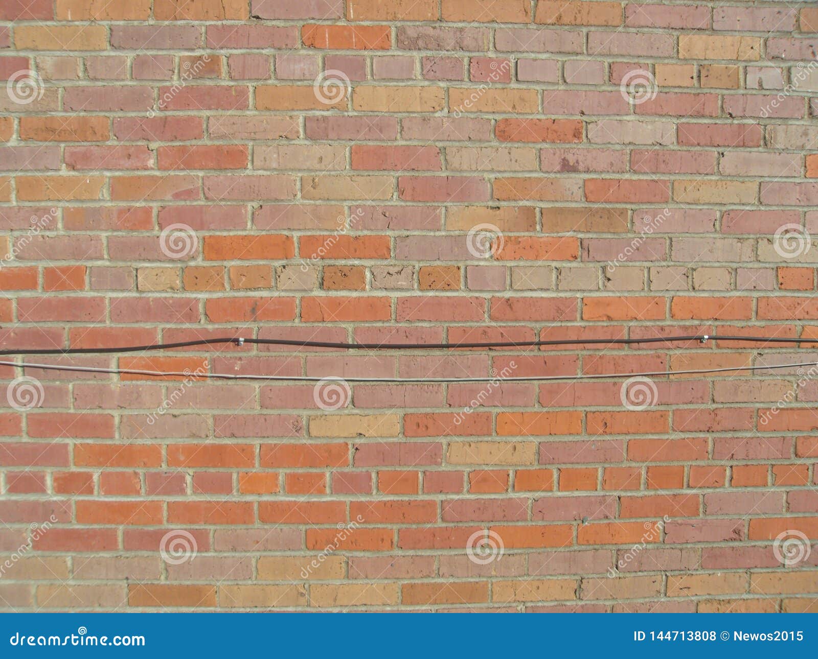 Brick wall with wires 2 stock photo. Image of wires - 144713808