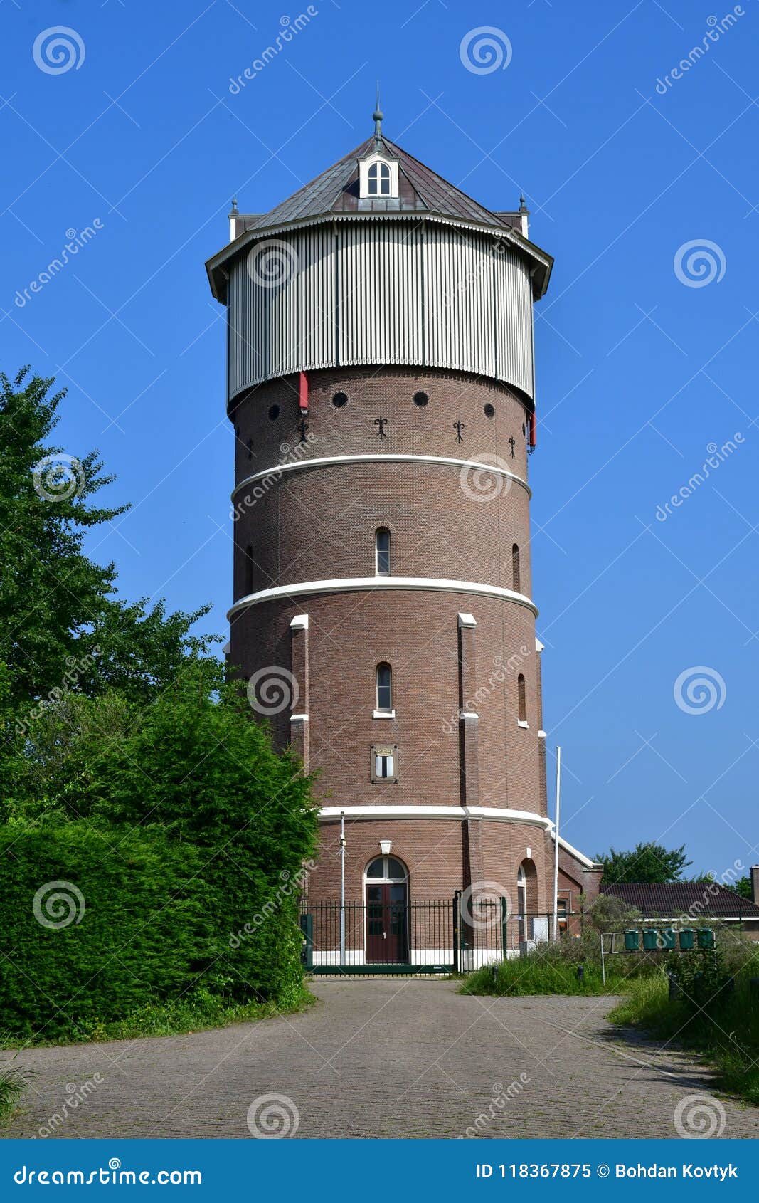 The Brick Water Tower and Tree Stock Image - Image of town ...